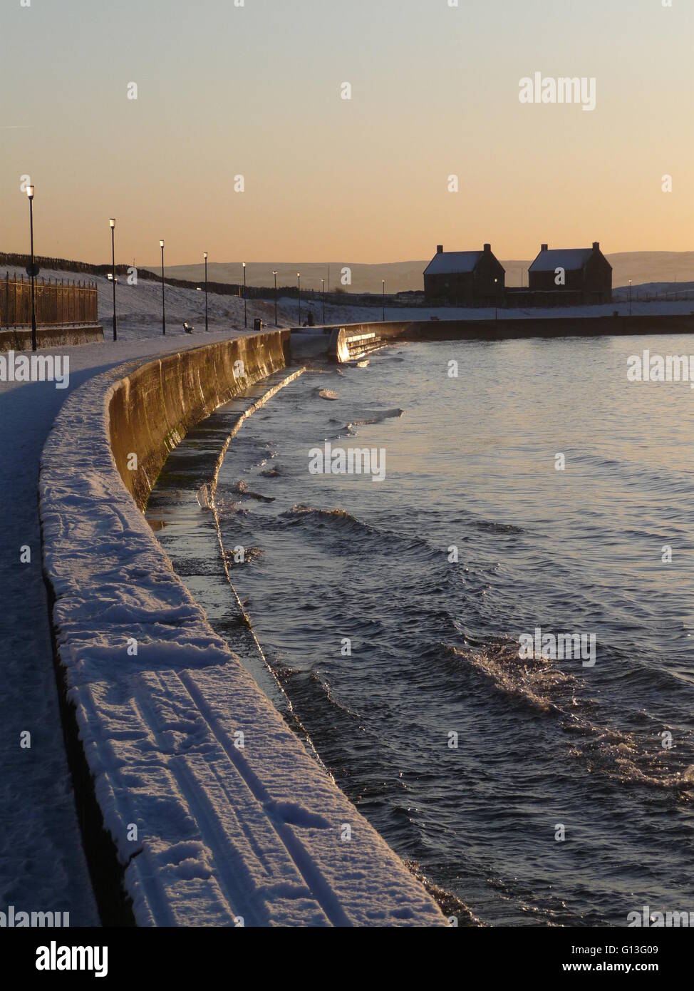 Winter sunset and snow covered esplanade at Prestwick, Ayrshire ...