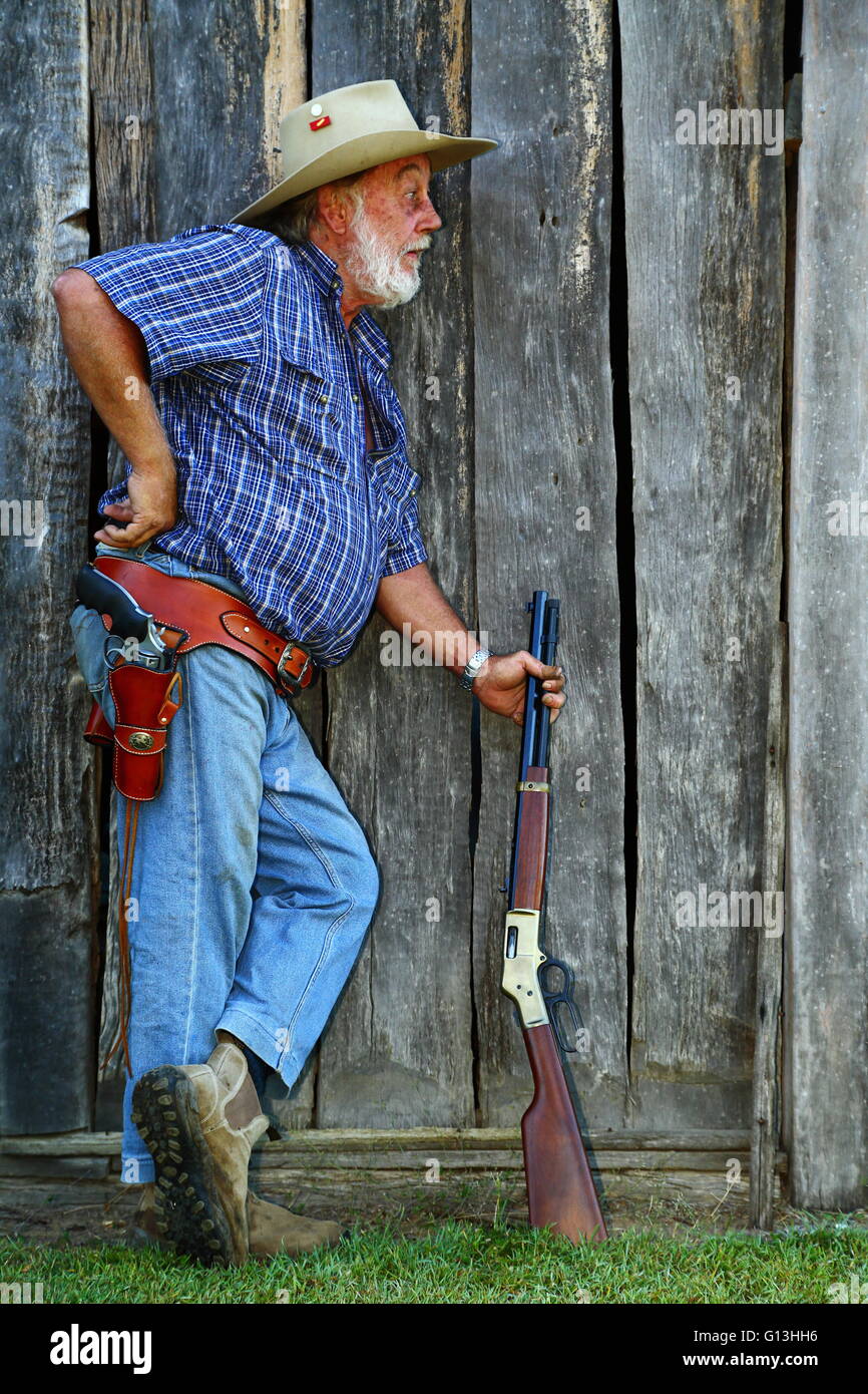 Cowboy with rifle hi-res stock photography and images - Alamy