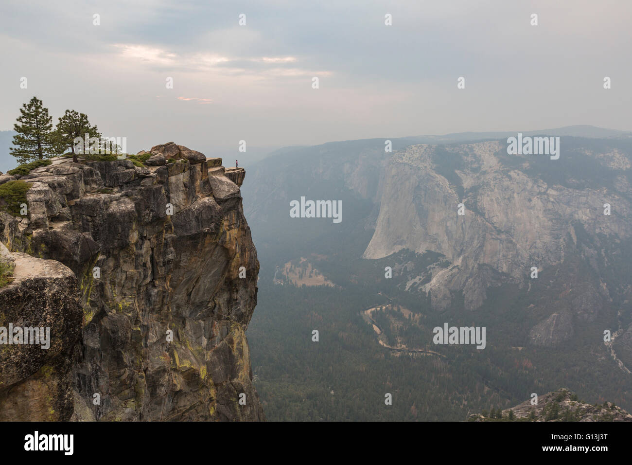 Person on the edge at Taft Point view Stock Photo - Alamy
