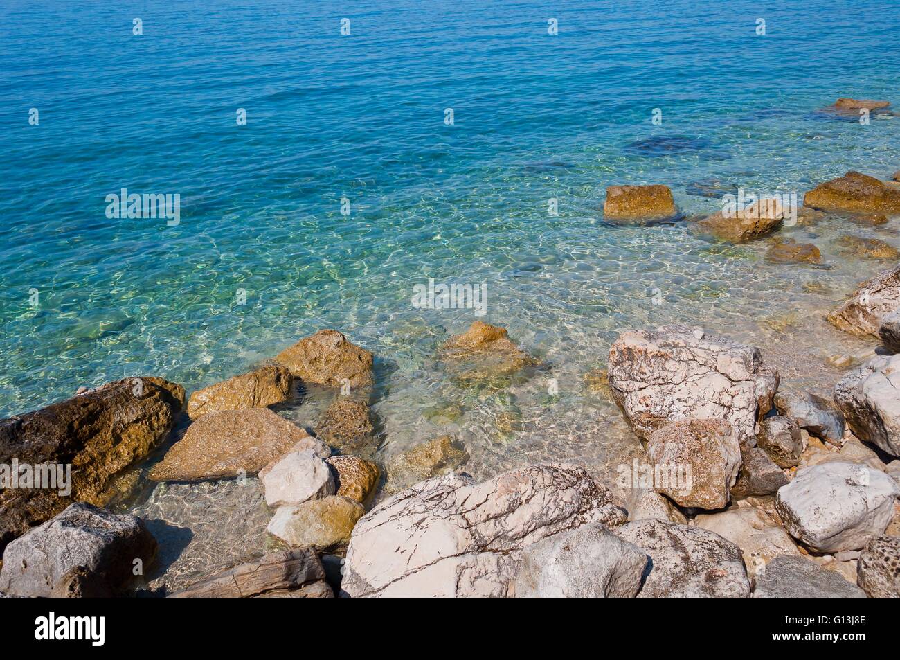 Beautiful beach with big stones and crystal clear adriatic sea. Podgora ...