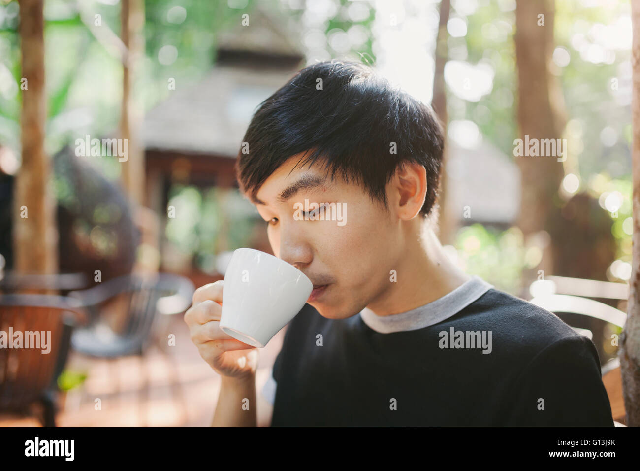 A man drinking on the morning coffee in sunshine light Stock Photo - Alamy