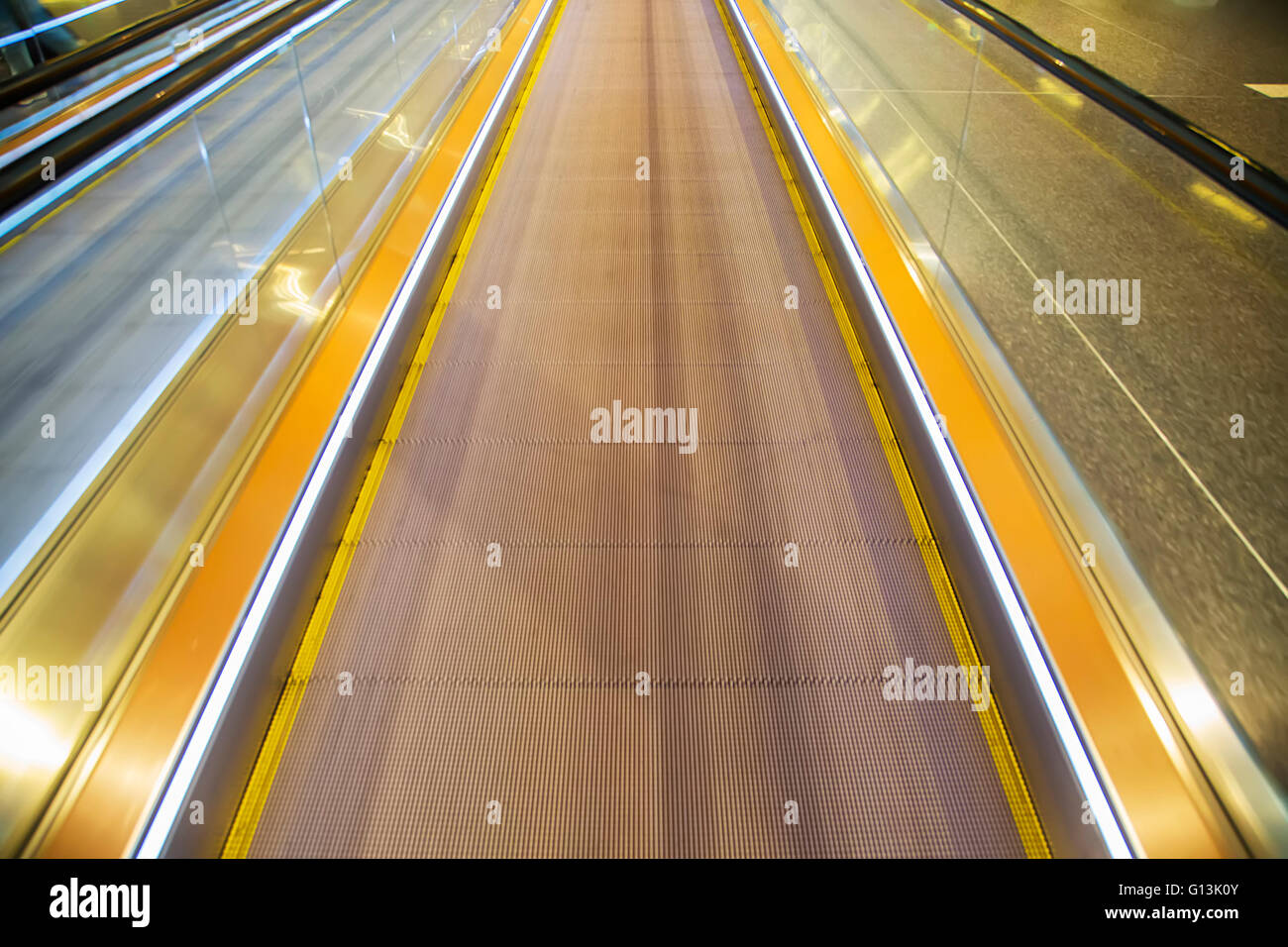 Close view of the moving walkway inside Stock Photo - Alamy