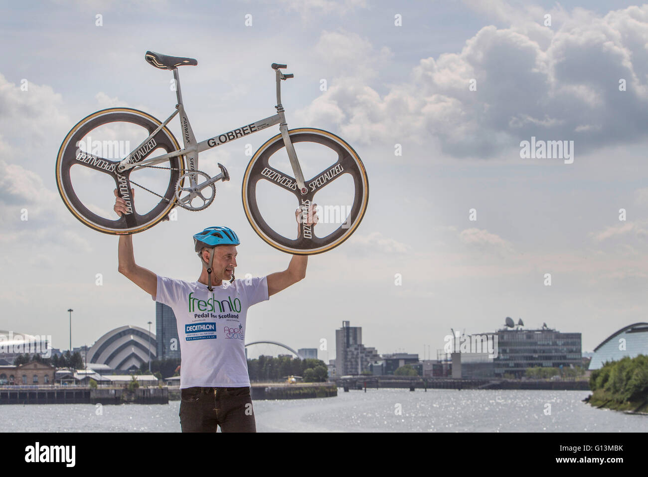 Graeme Obree with bike against Glasgow skyline Stock Photo - Alamy