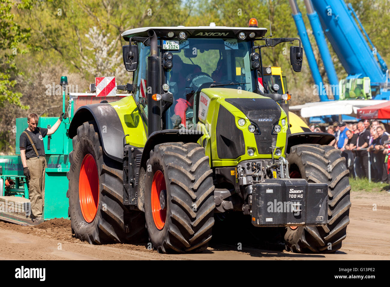 GRIMMEN/ GERMANY - MAY 5: german claas axion tractor drives on track by ...