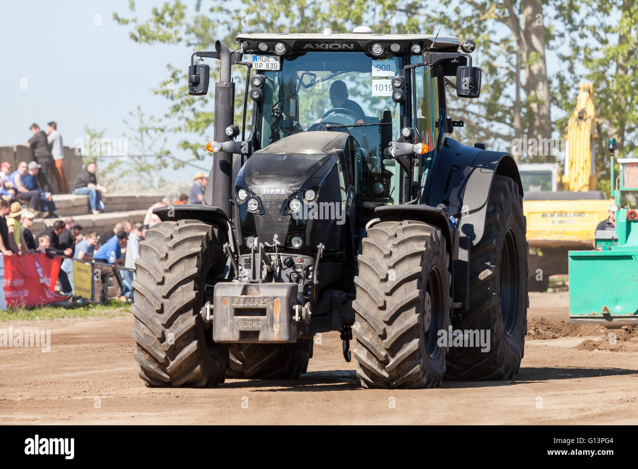 GRIMMEN/ GERMANY - MAY 5: german claas axion tractor drives on track by ...