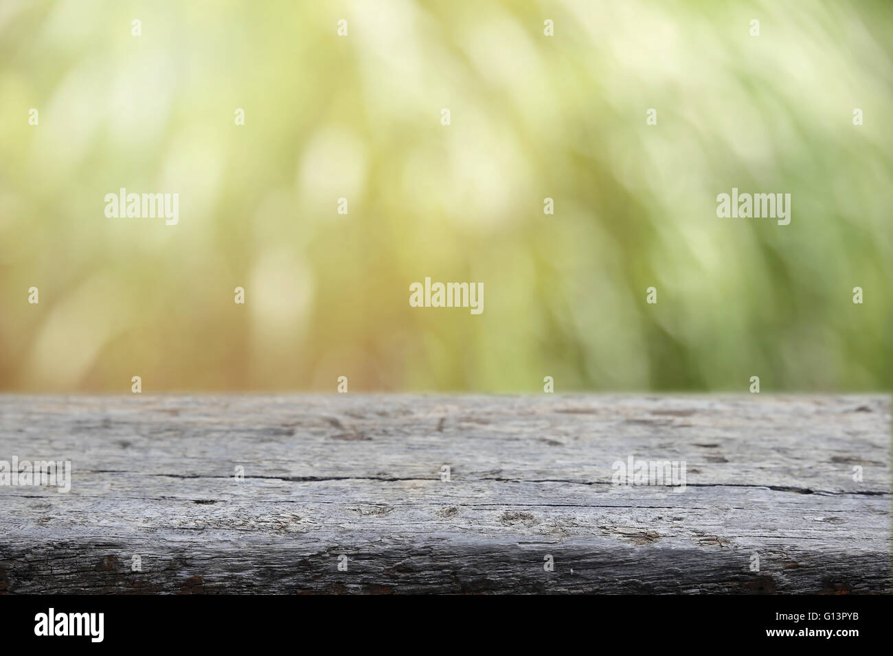 Rustic wooden counter top with blur bokeh garden background, Toning ...