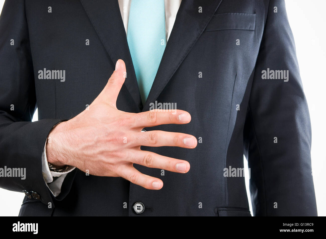 Ventral view of a young man in a black suit with the hands five fingers ...
