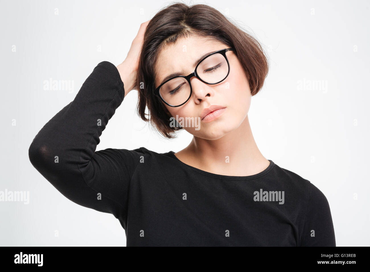 Sad woman standing isolated on a white background Stock Photo - Alamy