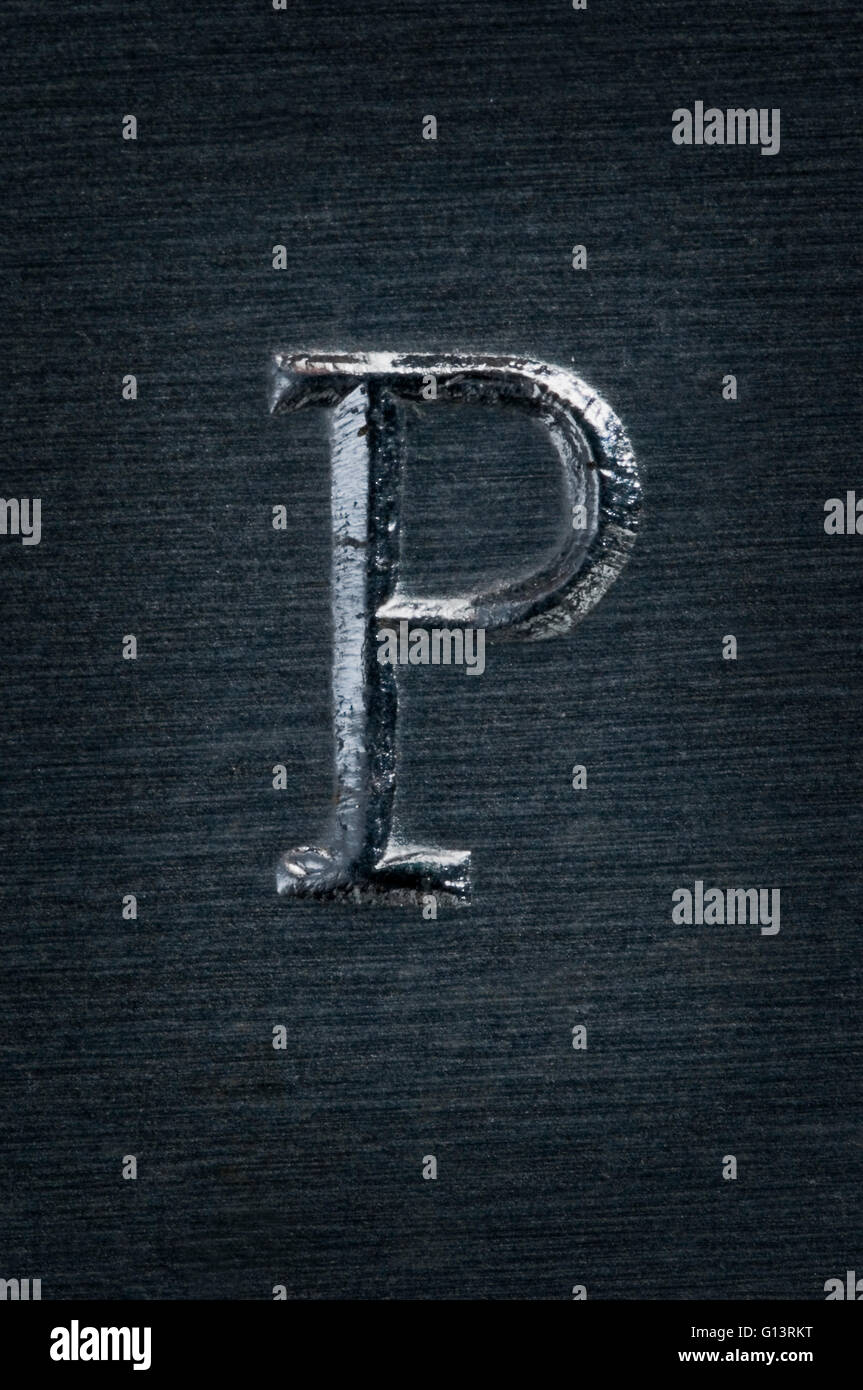 Macro view of a single letter "P" stamped in black metal Stock Photo ...