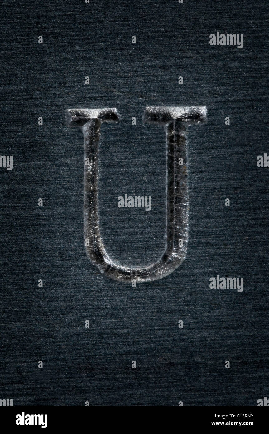 Macro view of a single letter "U" stamped in black metal Stock Photo ...