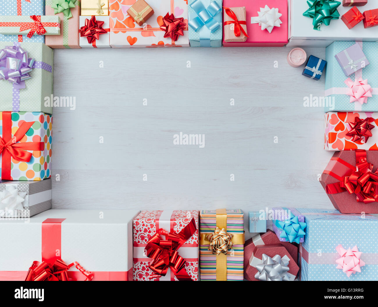 Colorful gift boxes framing blank copy space on desktop hi-res stock ...