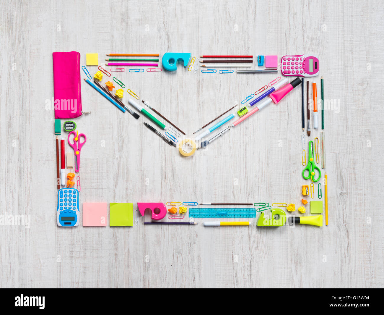 Creative e-mail icon composed by office stationery objects Stock Photo ...