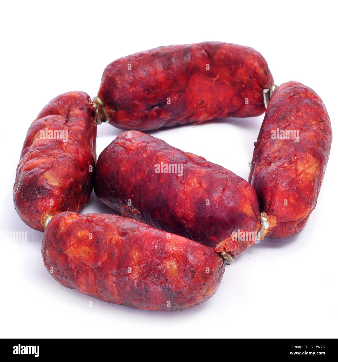 red spanish chorizos on a white background Stock Photo - Alamy