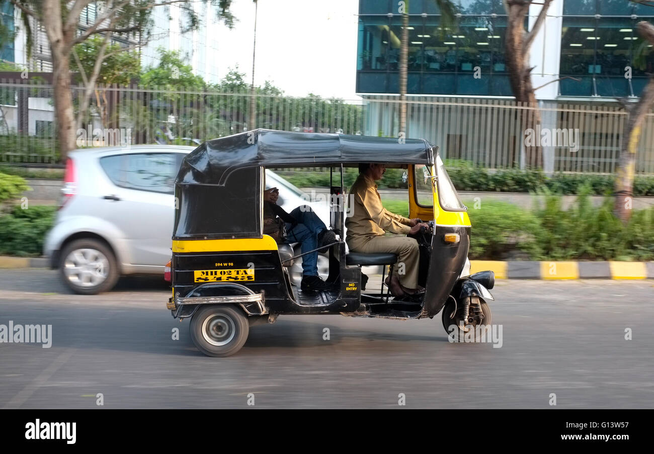 a moving rickshaw with passenger in mumbai, india Stock Photo - Alamy