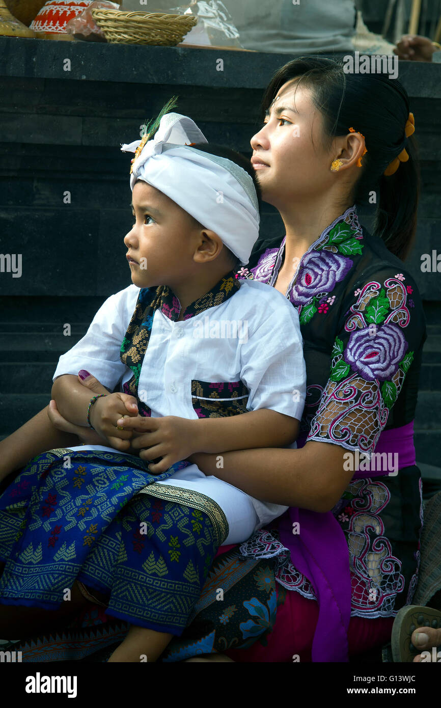 A mother and child at the Galungan festival in Amed, Bali Stock Photo ...
