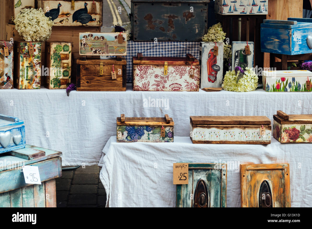 Decorated wooden boxes in a stall market in the street on an old ...