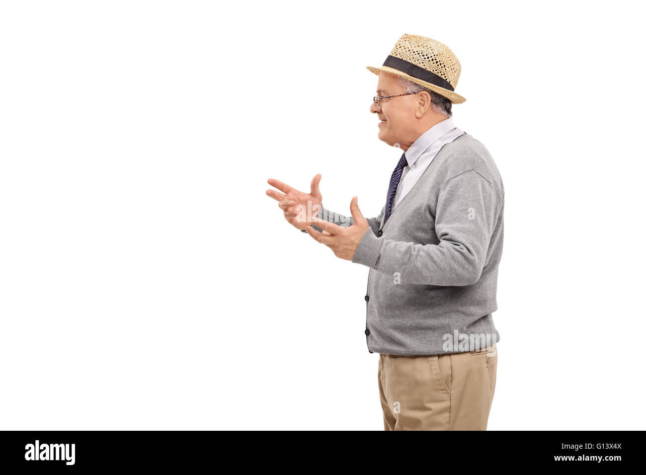 Studio shot of a senior gentleman explaining something isolated on ...
