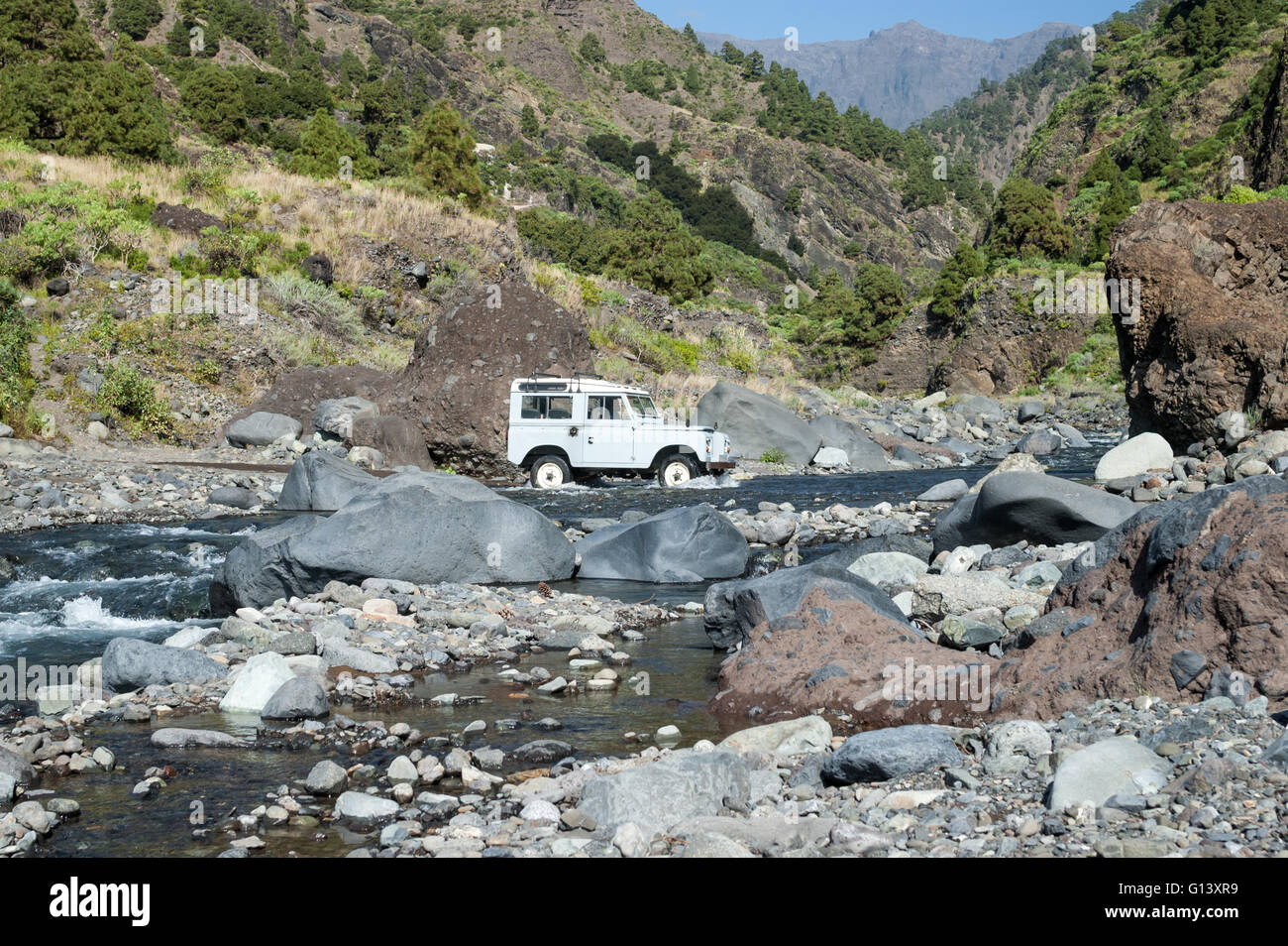 Four wheel drive driving through stream bed in the canyon Barranco de ...