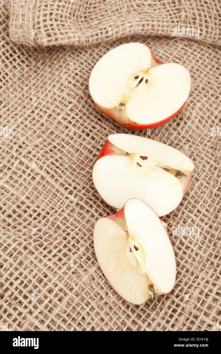 Sliced apple on burlap Stock Photo - Alamy