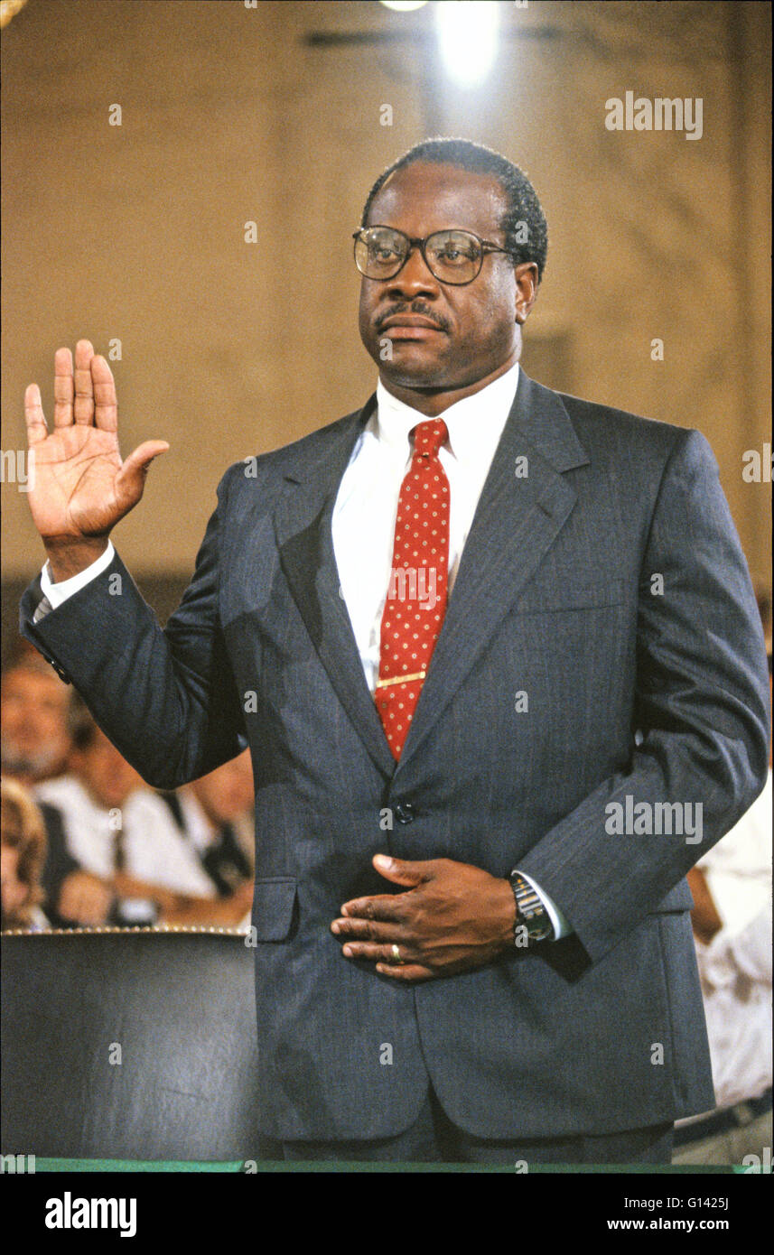 Judge Clarence Thomas is sworn-in to testify during the hearing before ...