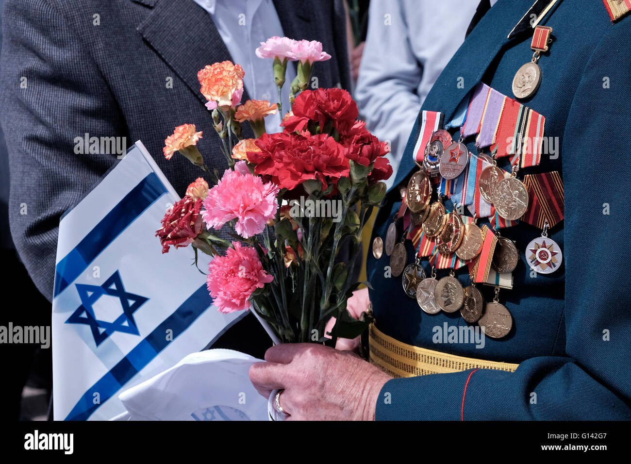 A Soviet Jewish World War II veteran with medals pinned in his old ...