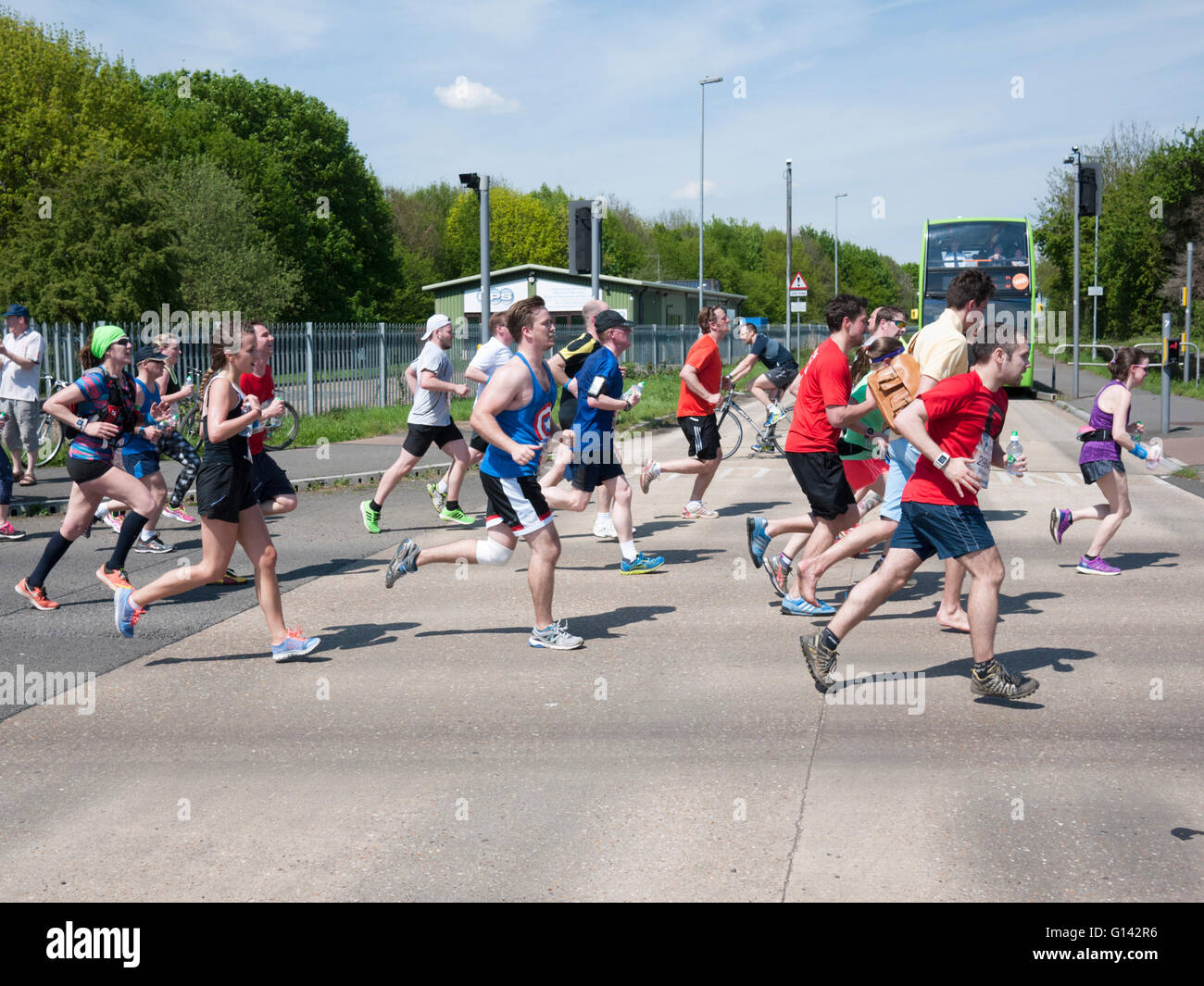 Runners pass finish line hi-res stock photography and images - Alamy