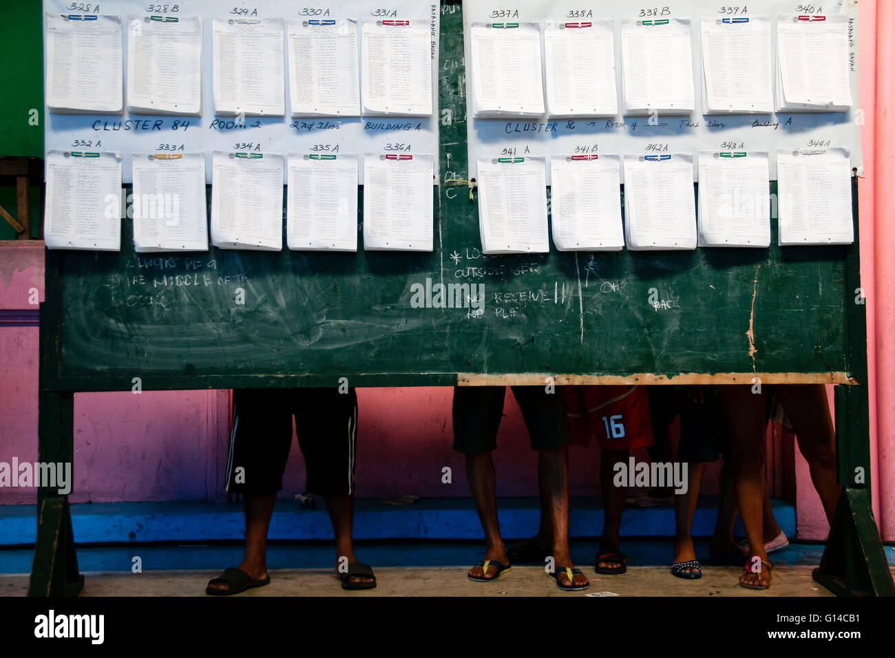 San Juan, Philippines. 09th May, 2016. A voter looks through pages of ...