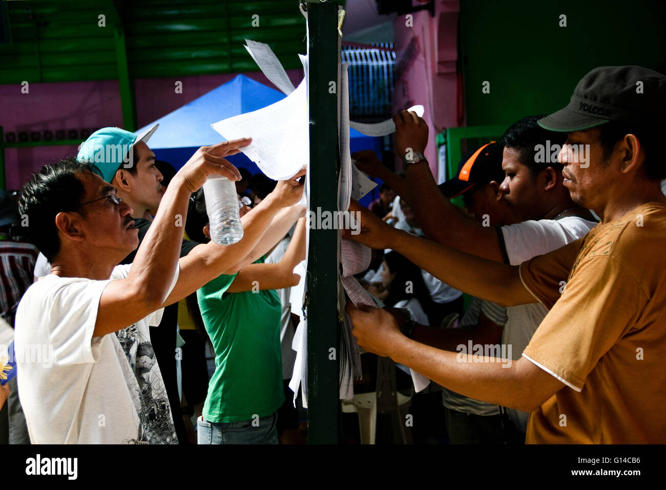 San Juan, Philippines. 09th May, 2016. A voter looks through pages of ...