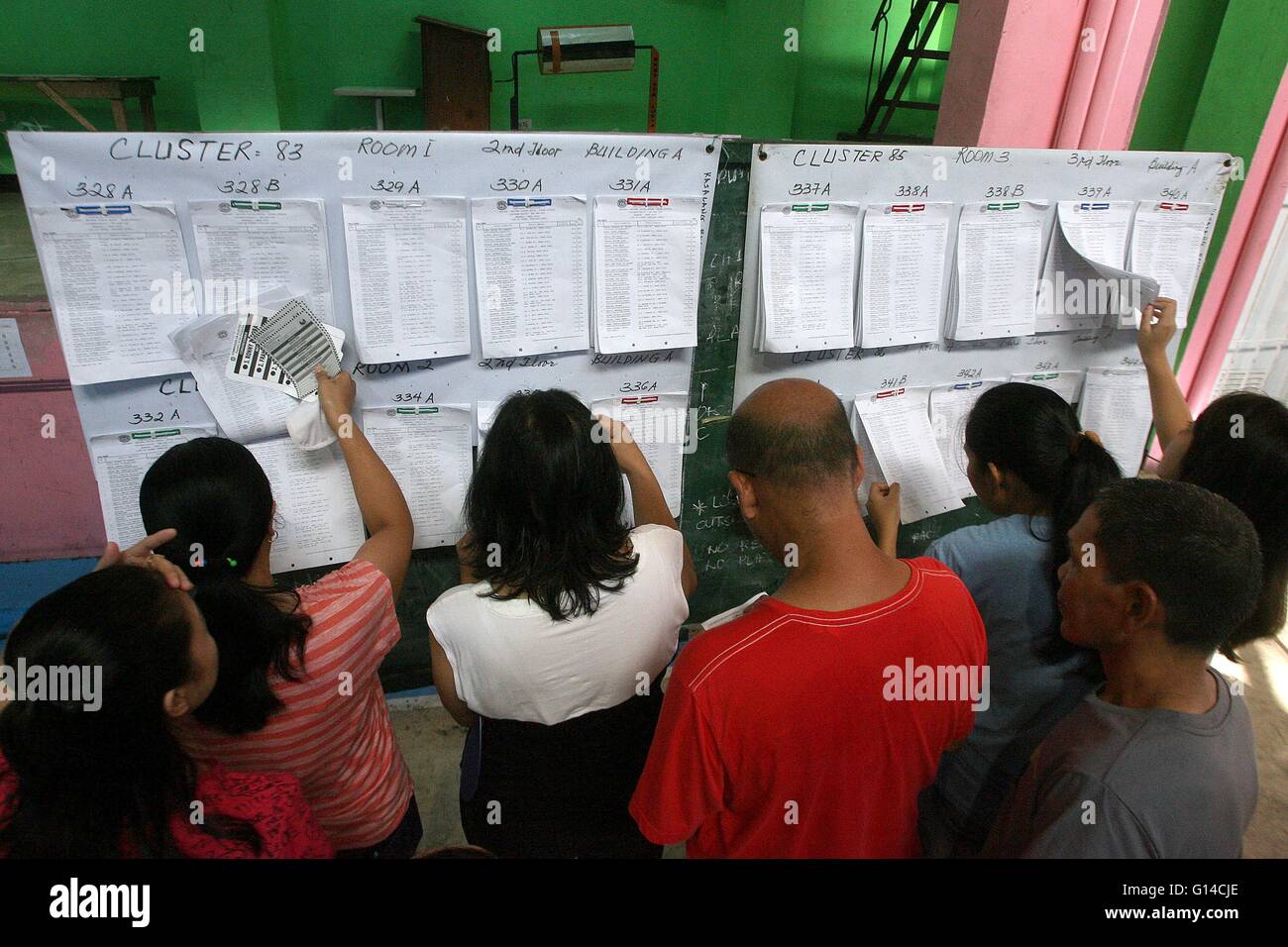 San Juan City, Philippines. 9th May, 2016. Voters look for their names ...