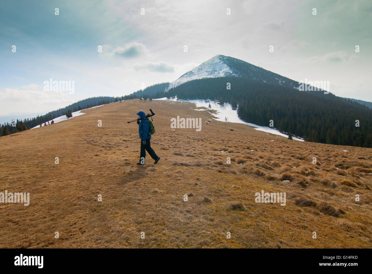 Lonely photographer in cold mountains Stock Photo - Alamy