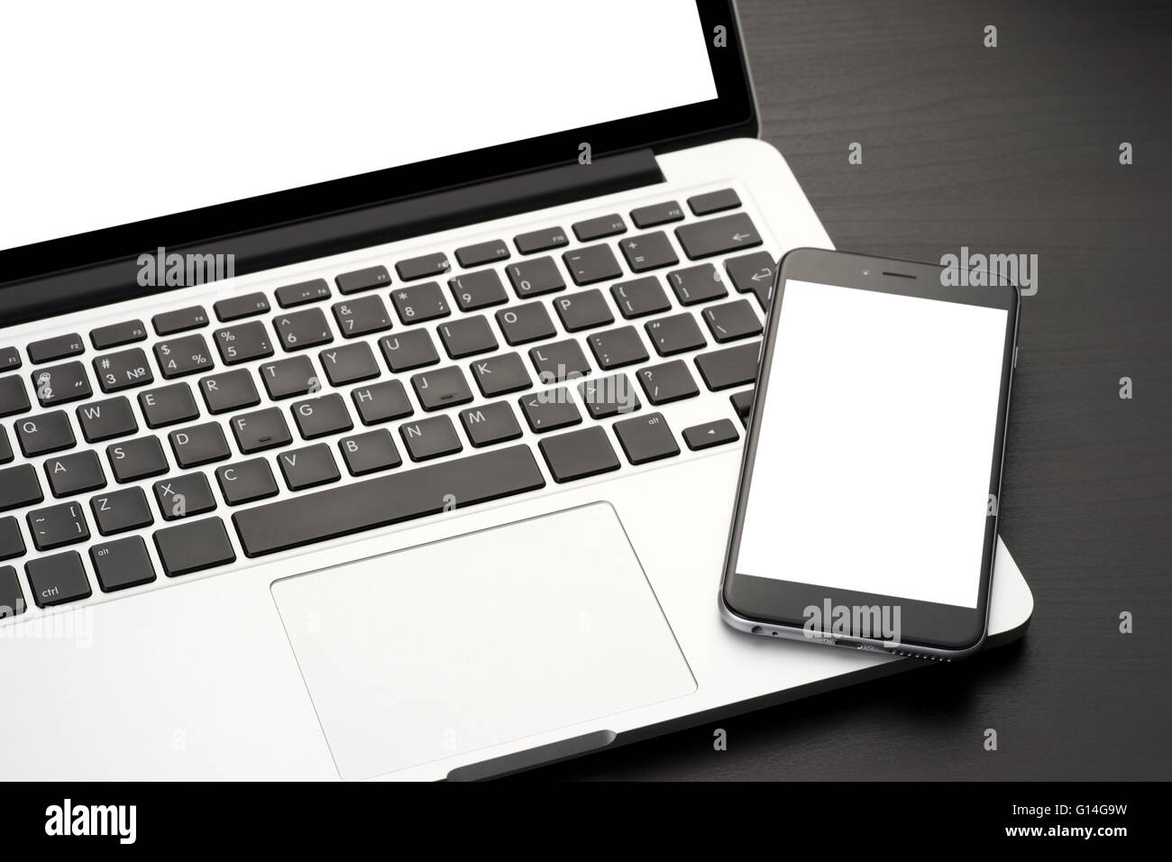 Smartphone and laptop Stock Photo - Alamy