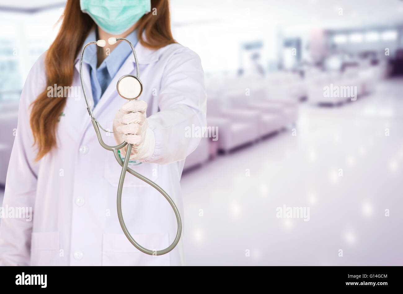 Female doctor with mask and stethoscope isolated on white background ...