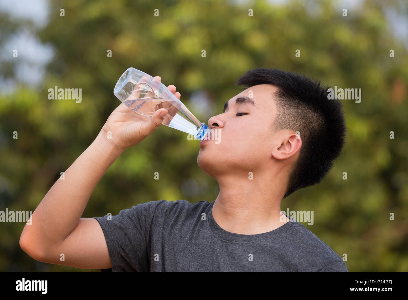Man drinking water handsome hi-res stock photography and images - Alamy