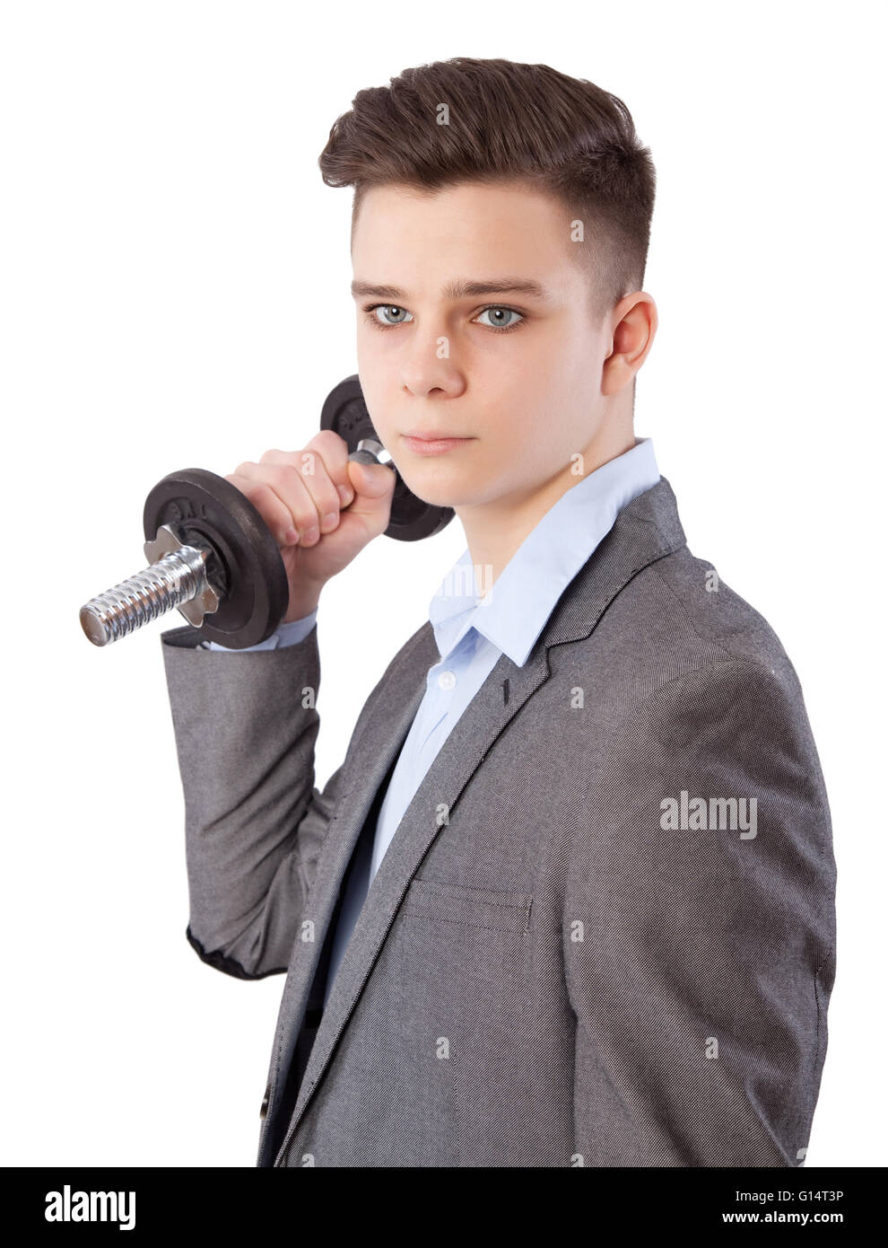 teenage boy exercising with dumbbell Stock Photo - Alamy