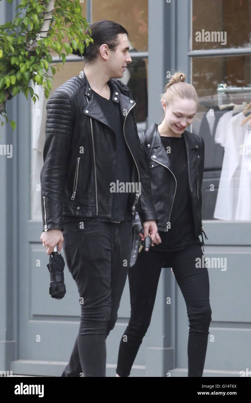 Nick Simmons and a female companion arriving at Alfred Coffee Featuring ...