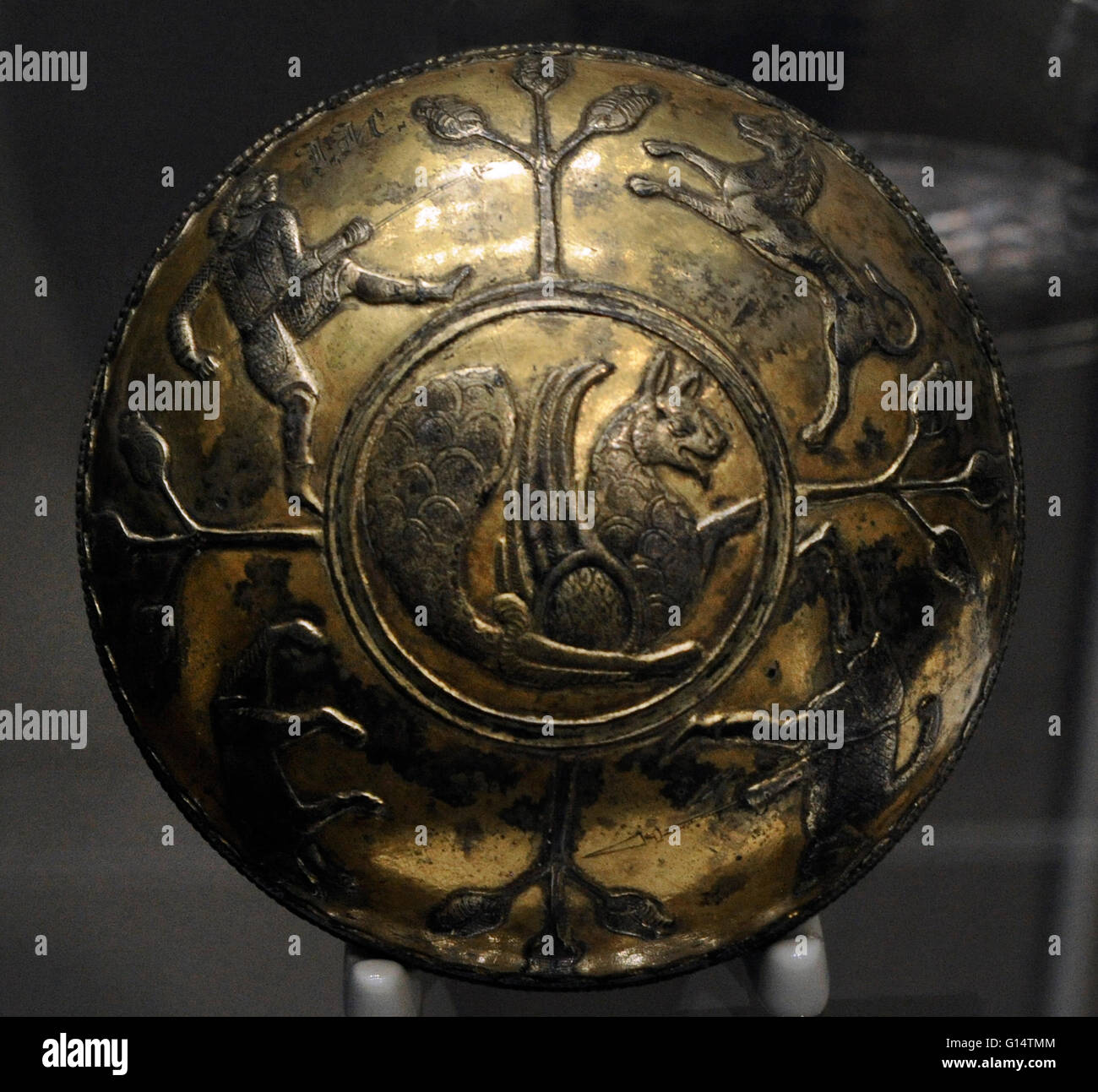 Sasanian bowl with a Simurgh and hunting scene. Silver; chasing ...
