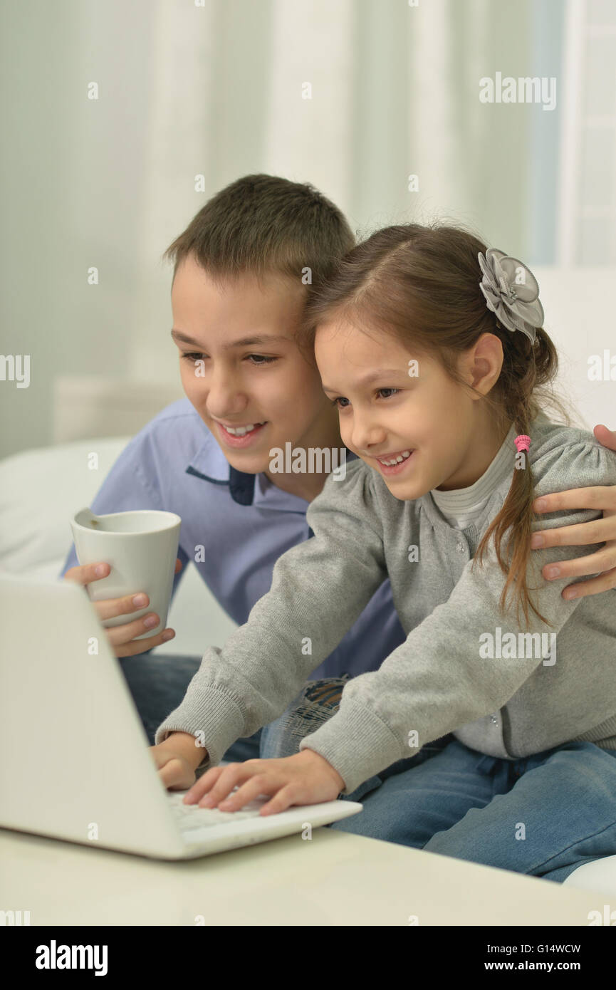 Children with laptop at home Stock Photo - Alamy