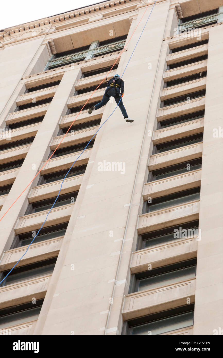 Detroit, Michigan - People rappel down a 25-story building as a ...