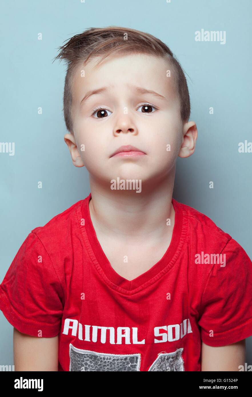 Portrait of a shocked boy Stock Photo - Alamy