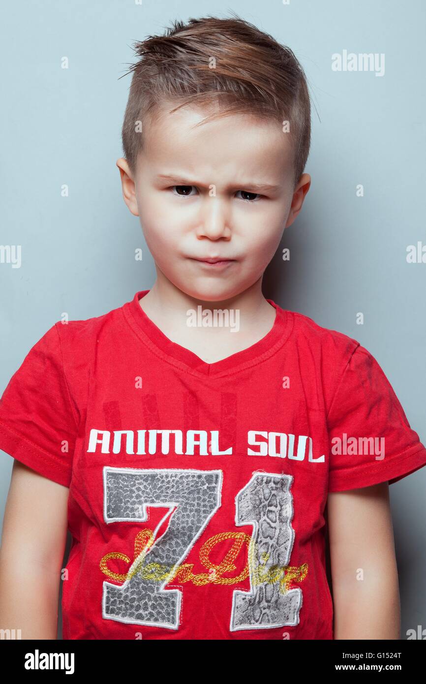 Portrait of an angry boy, looking toward the lens Stock Photo - Alamy