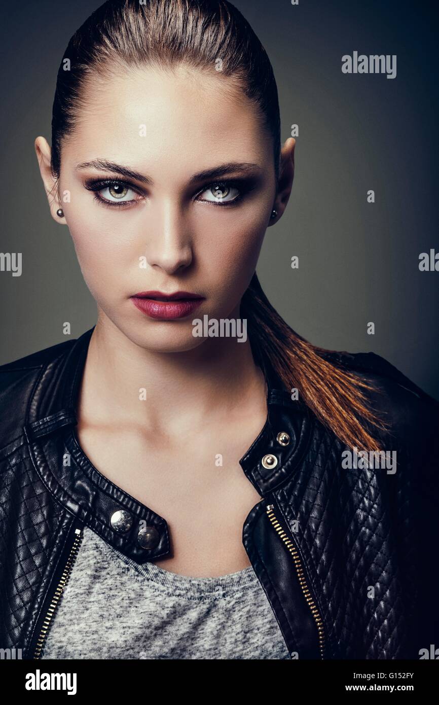 Portrait of a young woman hair pulled, face, eyes toward the lens Stock ...