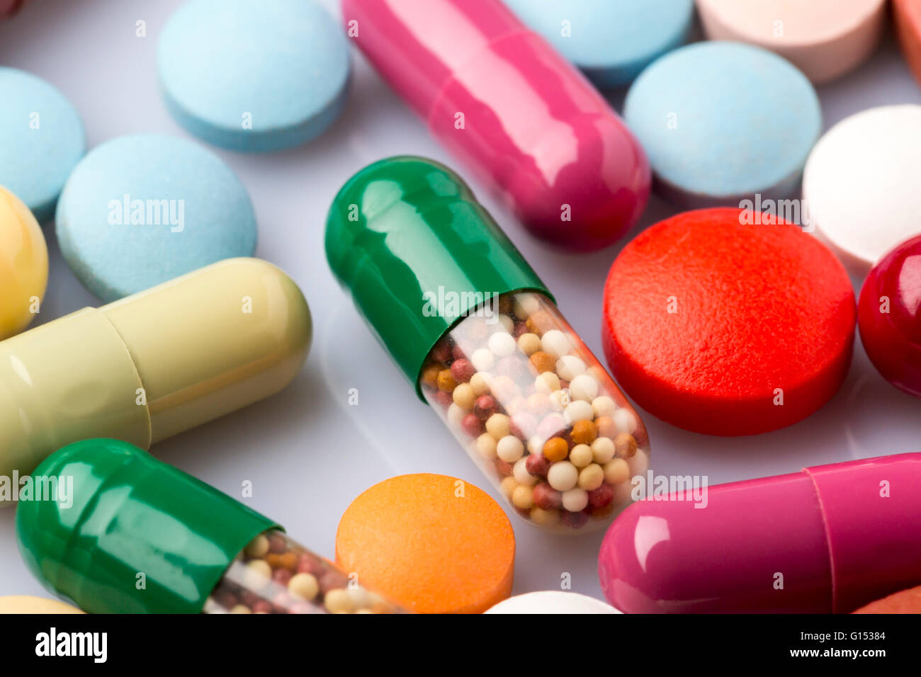 Scattered colorful medical pills and drugs Stock Photo - Alamy