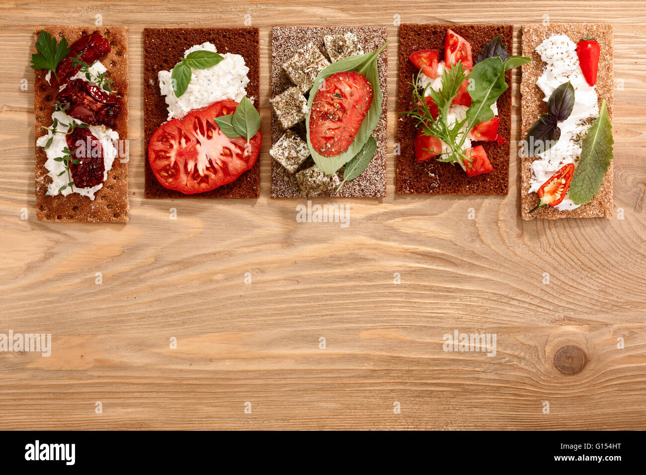 Different bread crisps (crispbread open-faced sandwiches) with both ...