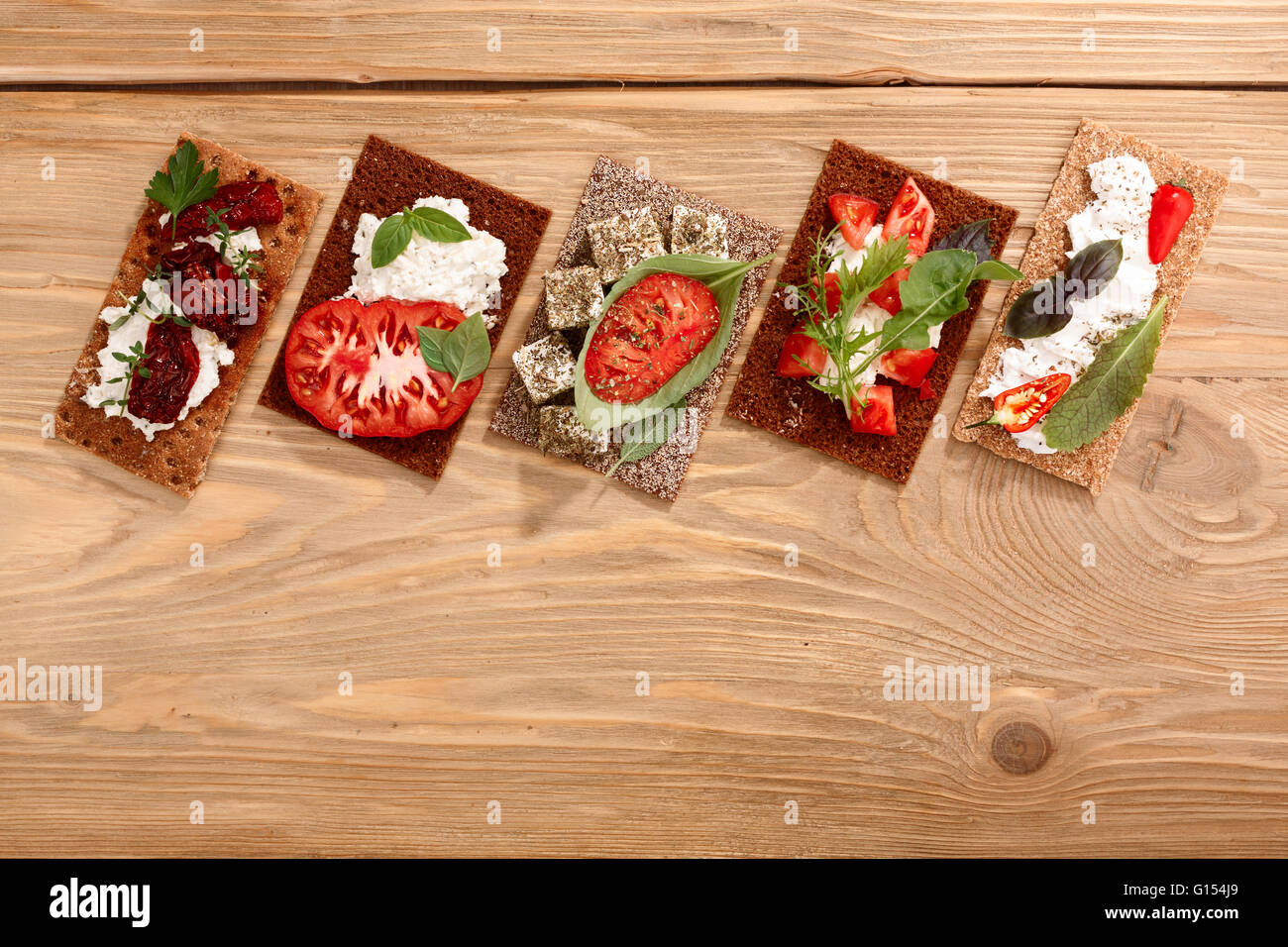 Different bread crisps (crispbread open-faced sandwiches) with both ...