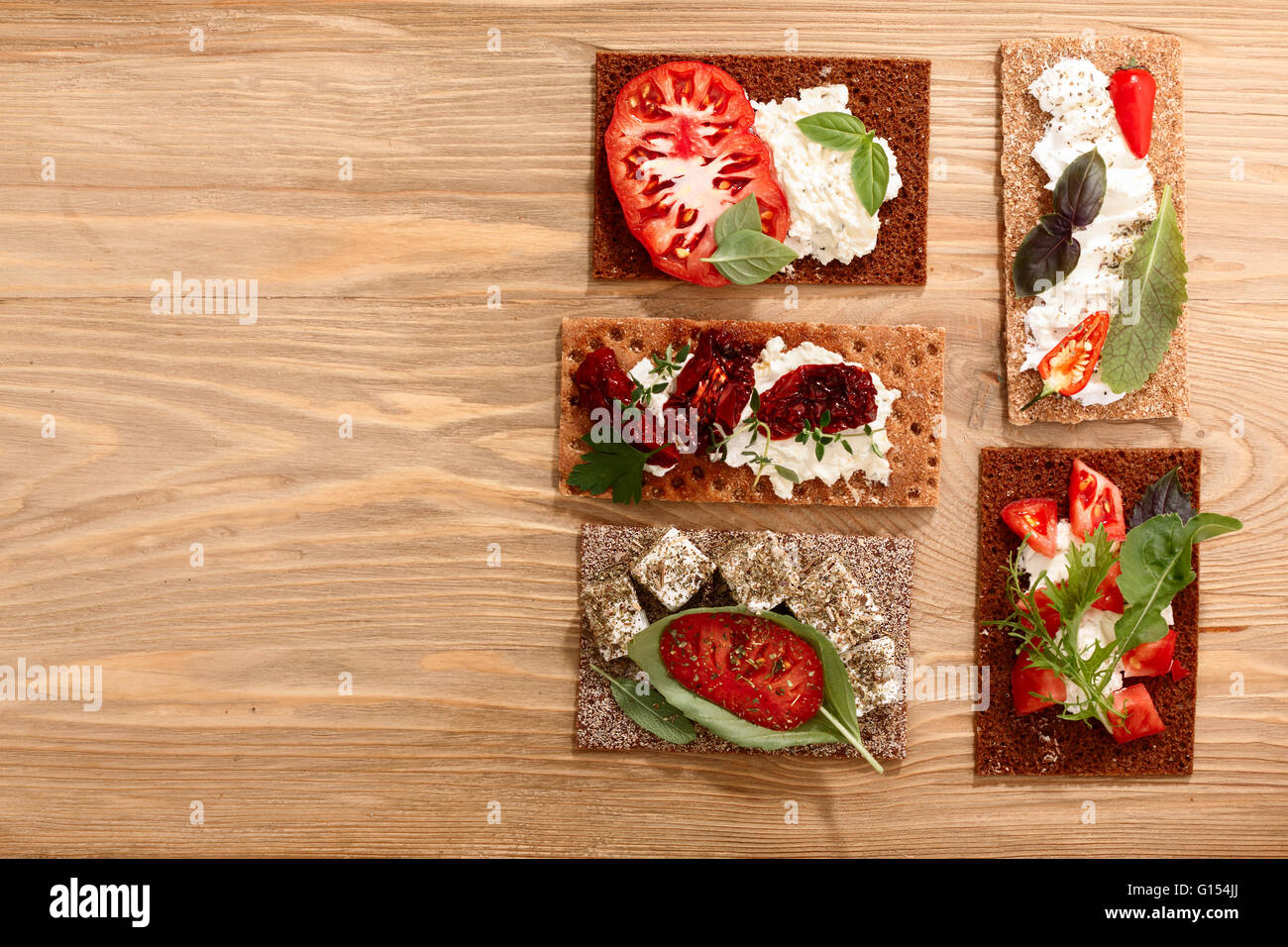 Different bread crisps (crispbread open-faced sandwiches) with both ...