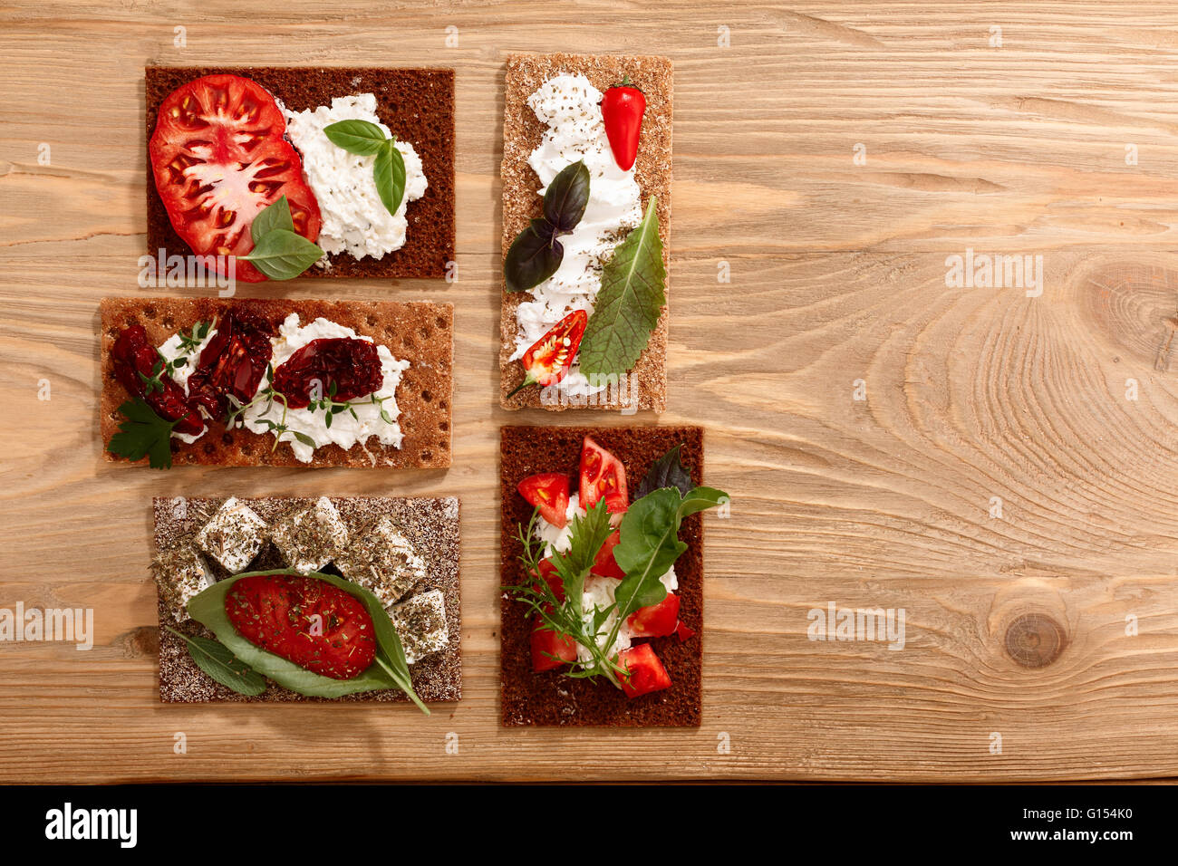 Different bread crisps (crispbread open-faced sandwiches) with both ...