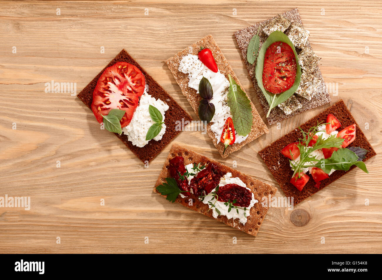 Different bread crisps (crispbread open-faced sandwiches) with both ...
