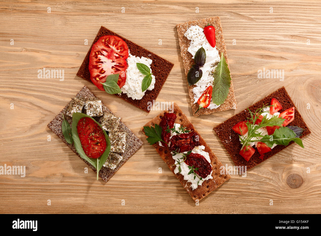 Different bread crisps (crispbread open-faced sandwiches) with both ...