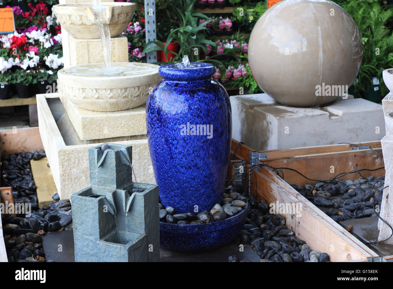 Man made Water fountains for garden decoration Stock Photo - Alamy