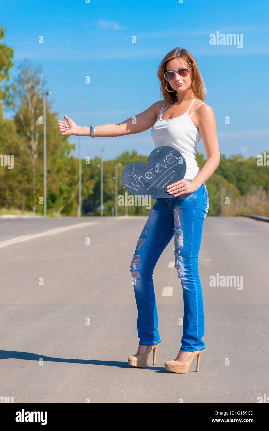 Girl hitchhiking hi-res stock photography and images - Alamy